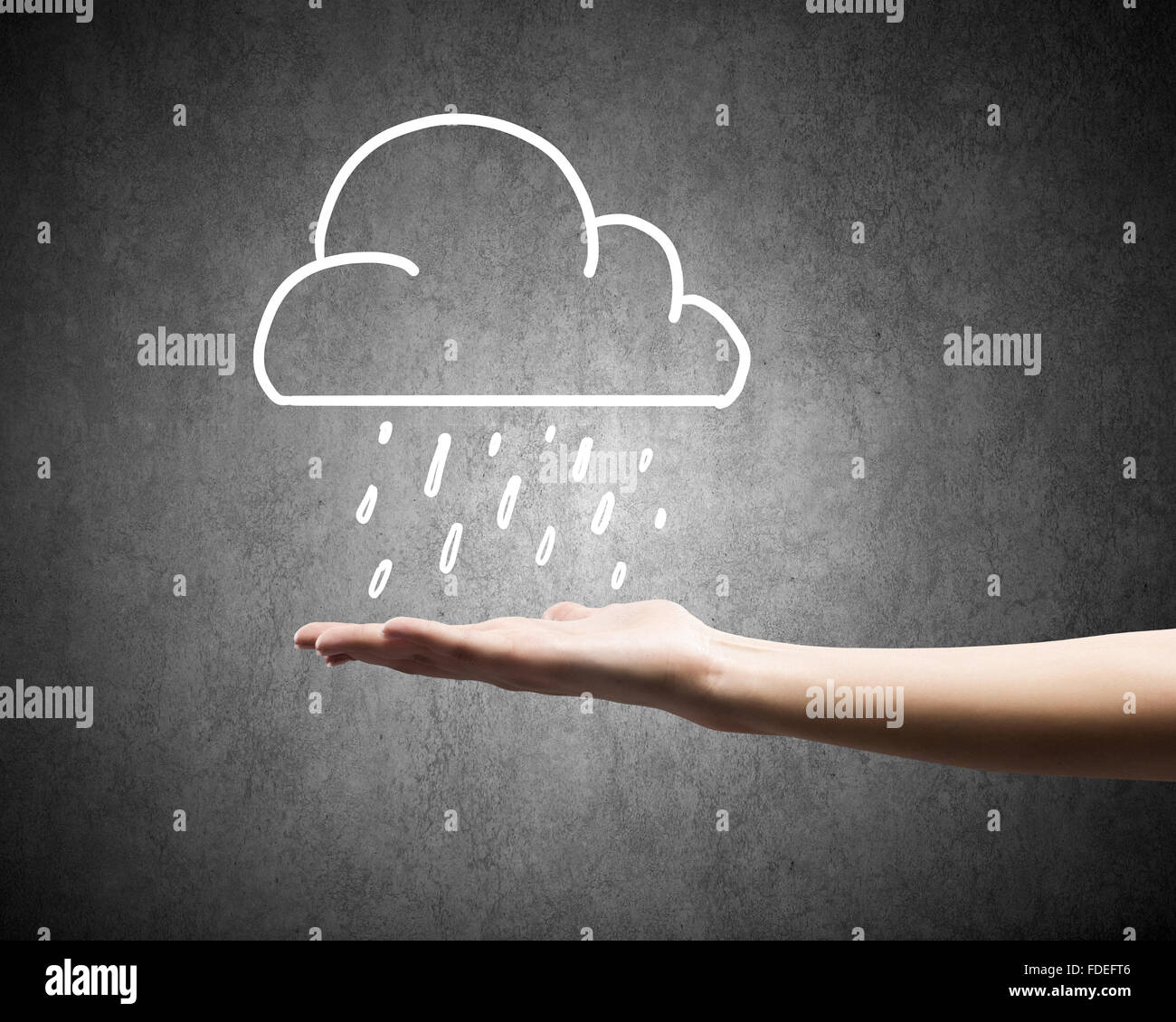Background conceptual image with raining cloud in hand Stock Photo - Alamy