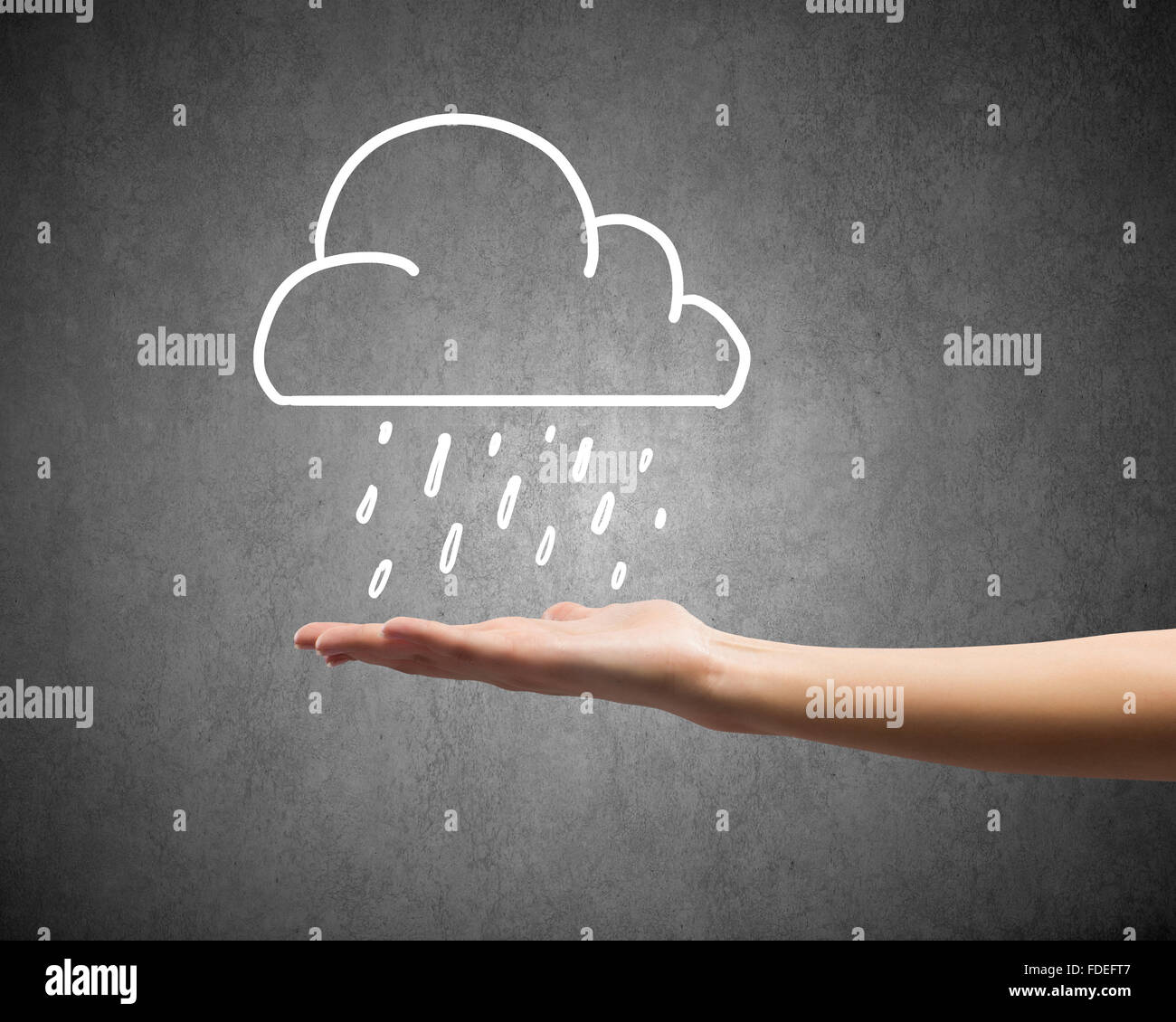 Background conceptual image with raining cloud in hand Stock Photo - Alamy