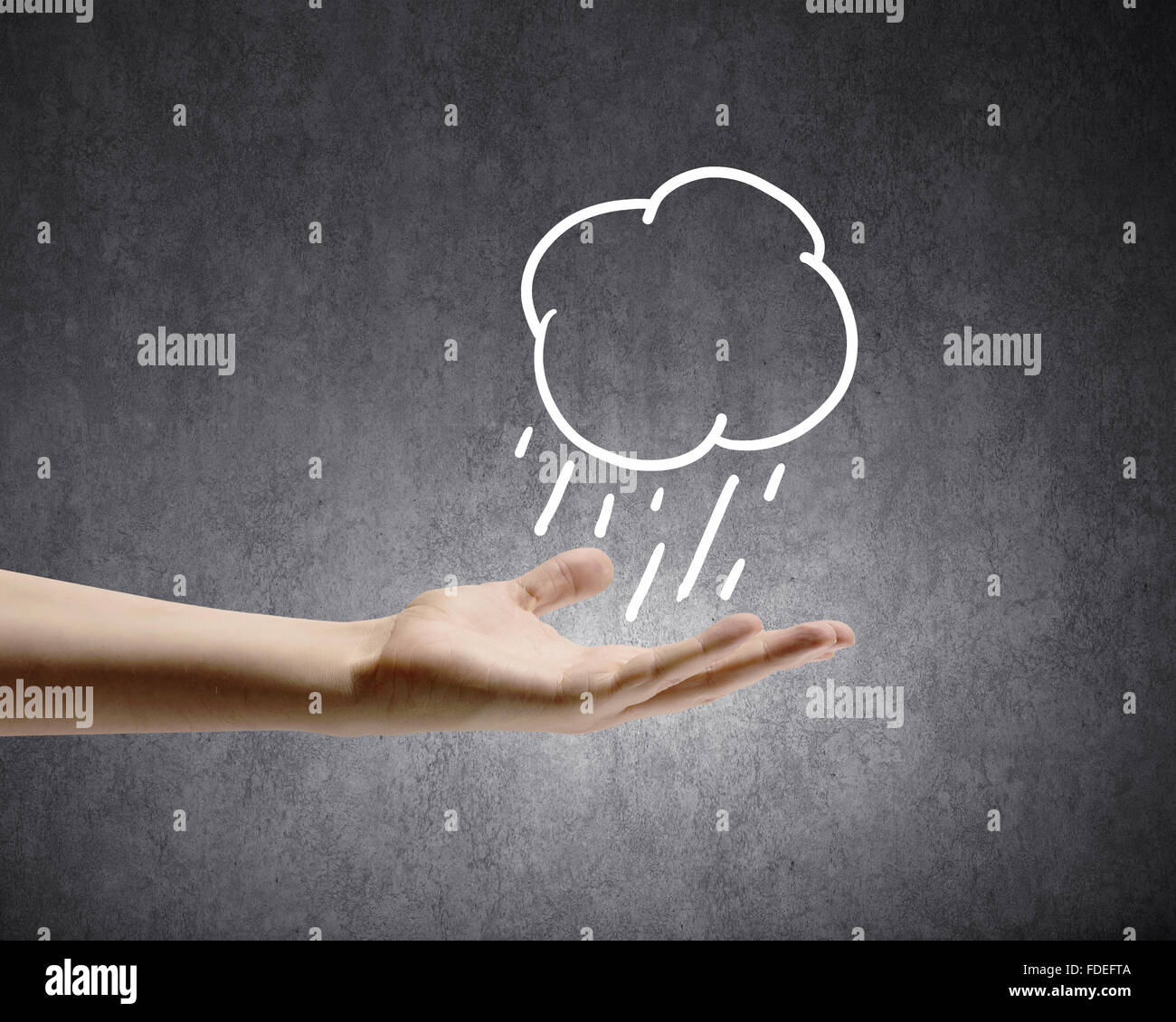 Background conceptual image with raining cloud in hand Stock Photo - Alamy