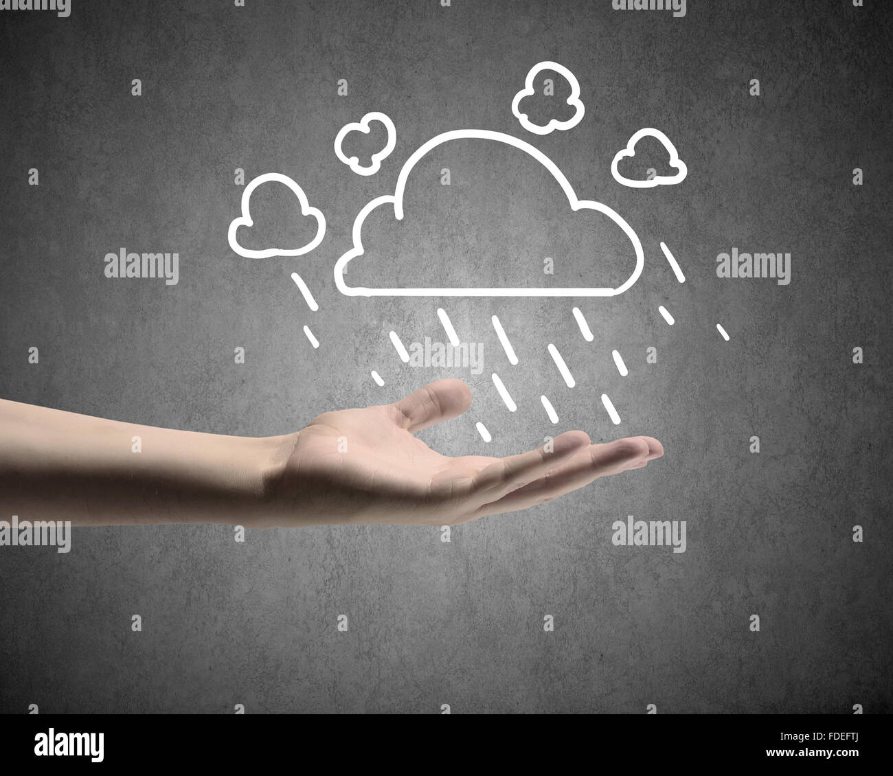 Background conceptual image with raining cloud in hand Stock Photo - Alamy
