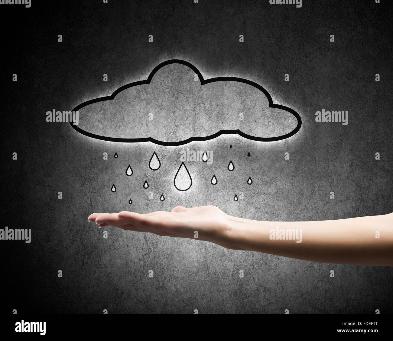 Background conceptual image with raining cloud in hand Stock Photo - Alamy