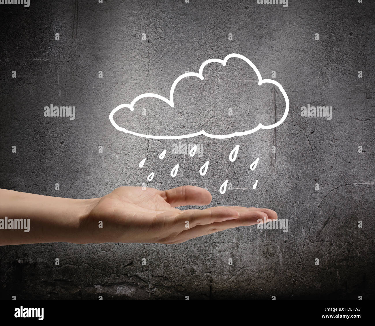 Background conceptual image with raining cloud in hand Stock Photo - Alamy