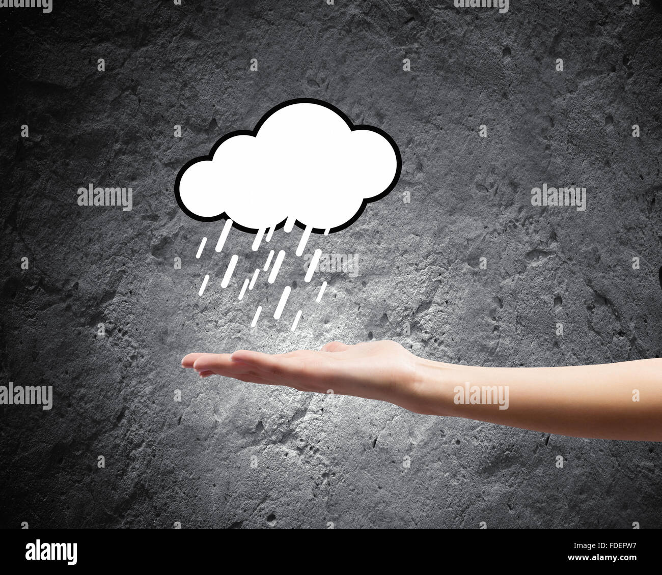 Background conceptual image with raining cloud in hand Stock Photo - Alamy