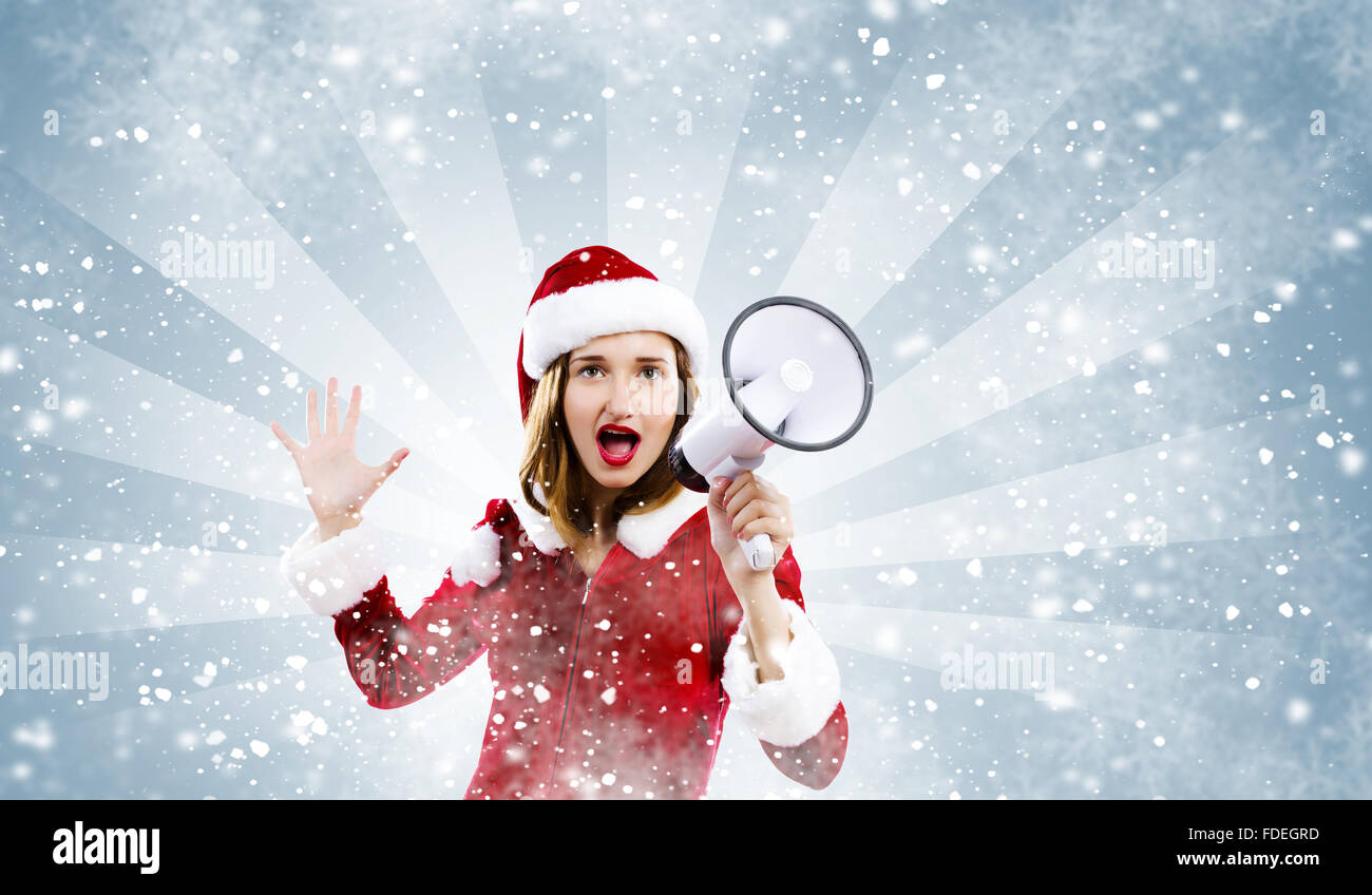 Young attractive Santa girl listening music in headphones Stock Photo ...