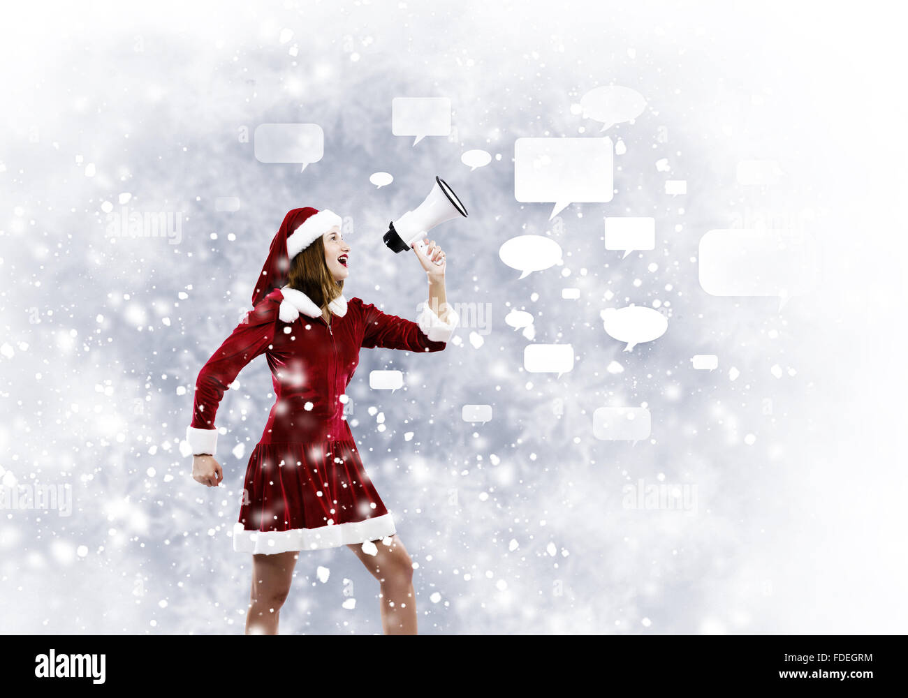 Young attractive Santa girl listening music in headphones Stock Photo ...
