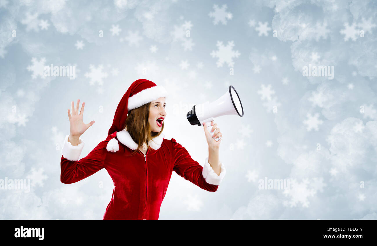 Young attractive Santa girl listening music in headphones Stock Photo ...