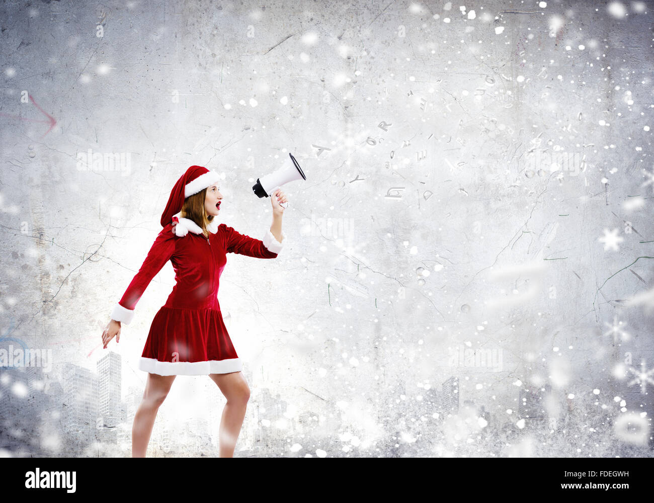 Young attractive Santa girl listening music in headphones Stock Photo ...