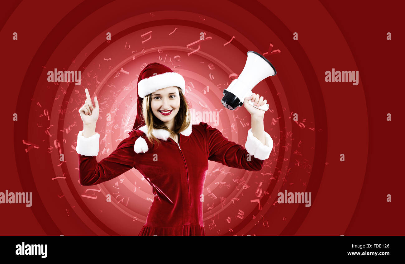 Young attractive Santa girl listening music in headphones Stock Photo ...