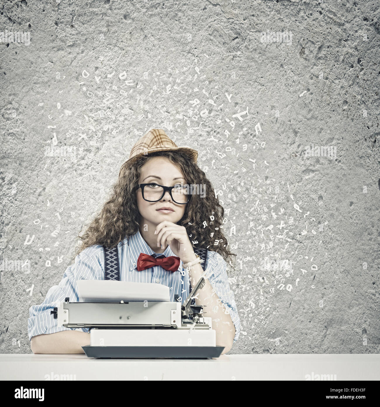 Young funny woman in glasses using typewriter Stock Photo - Alamy