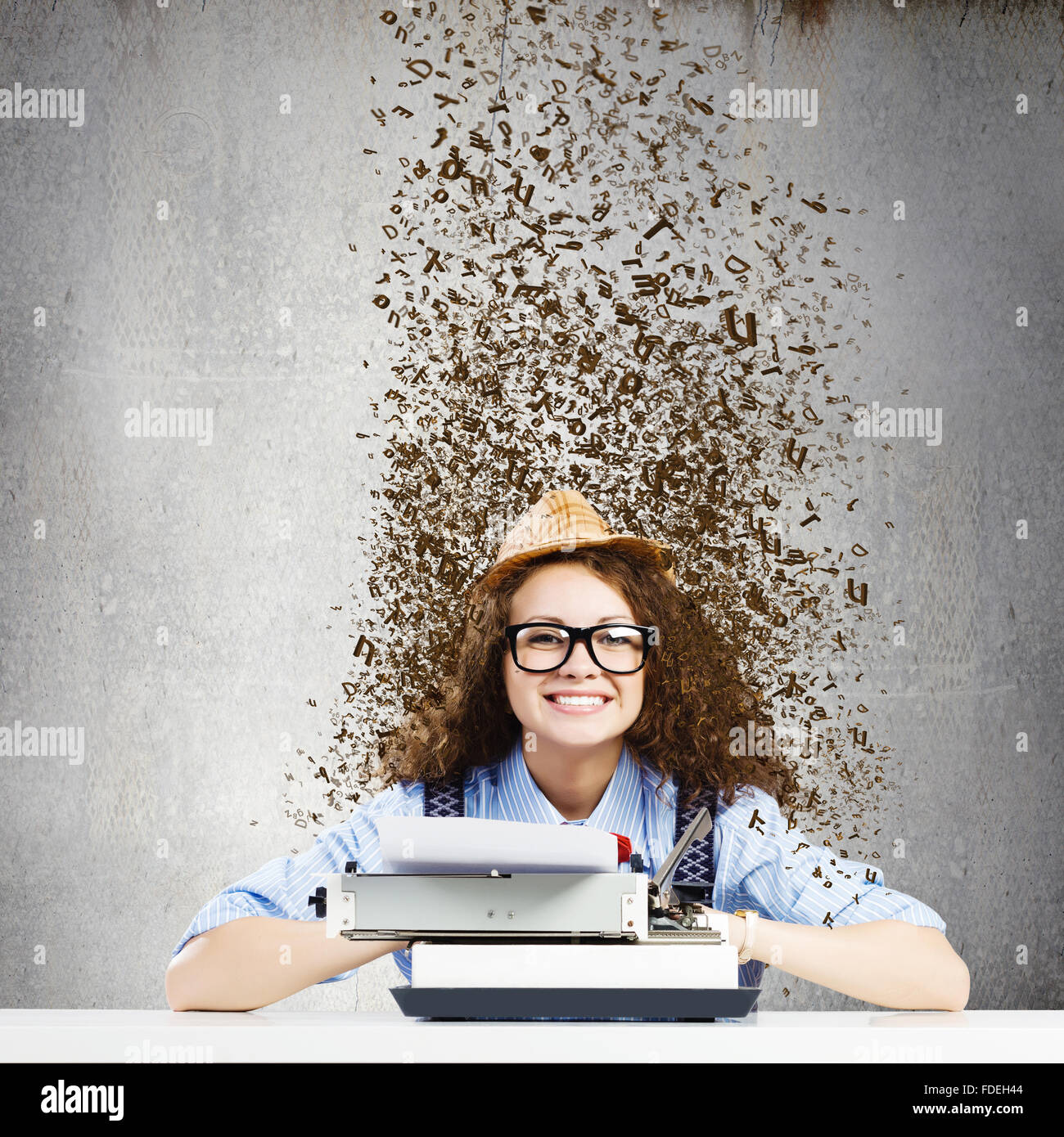 Young funny woman in glasses using typewriter Stock Photo - Alamy