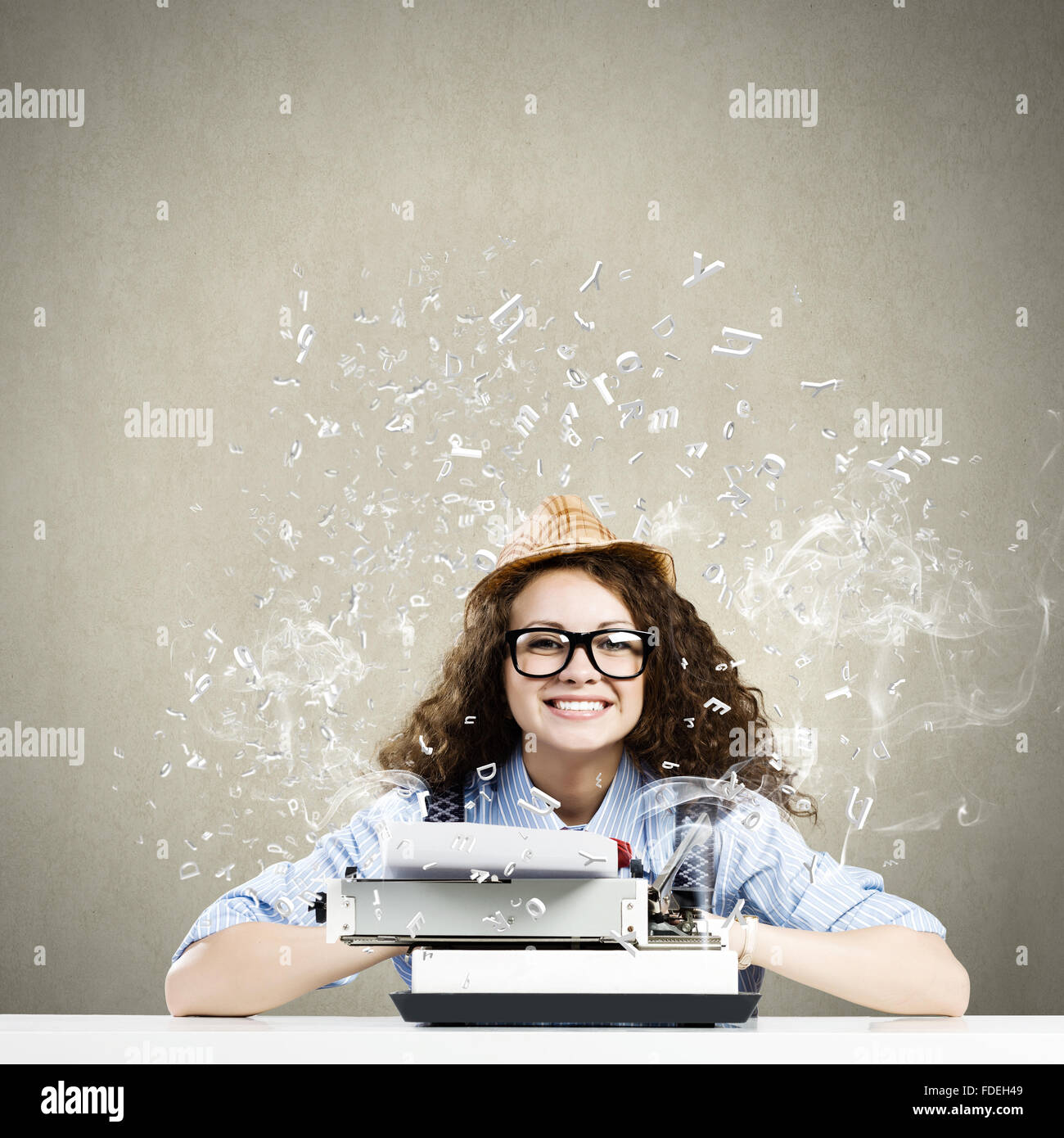 Young funny woman in glasses using typewriter Stock Photo - Alamy