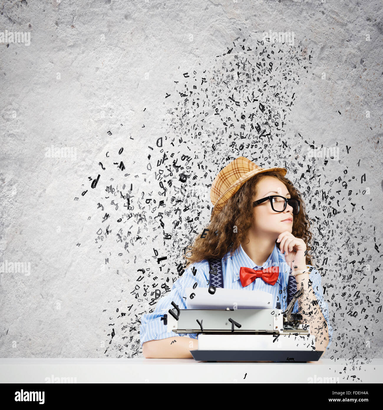 Young funny woman in glasses using typewriter Stock Photo - Alamy