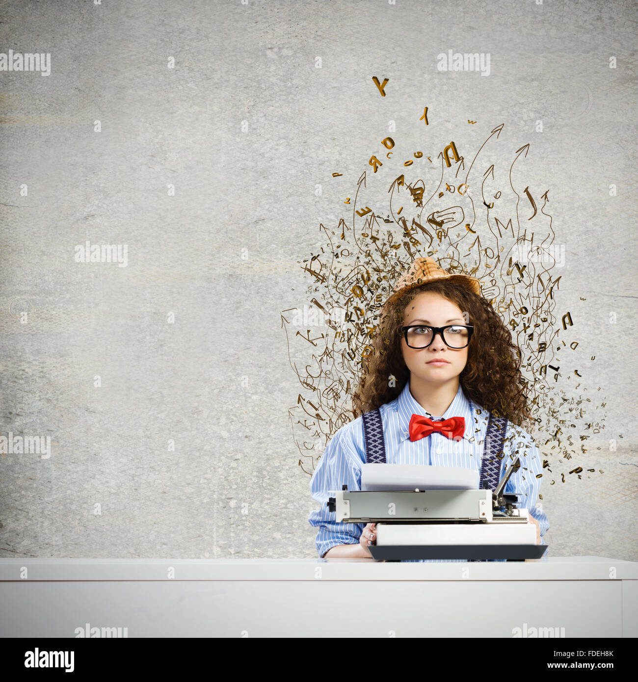 Young funny woman in glasses using typewriter Stock Photo - Alamy