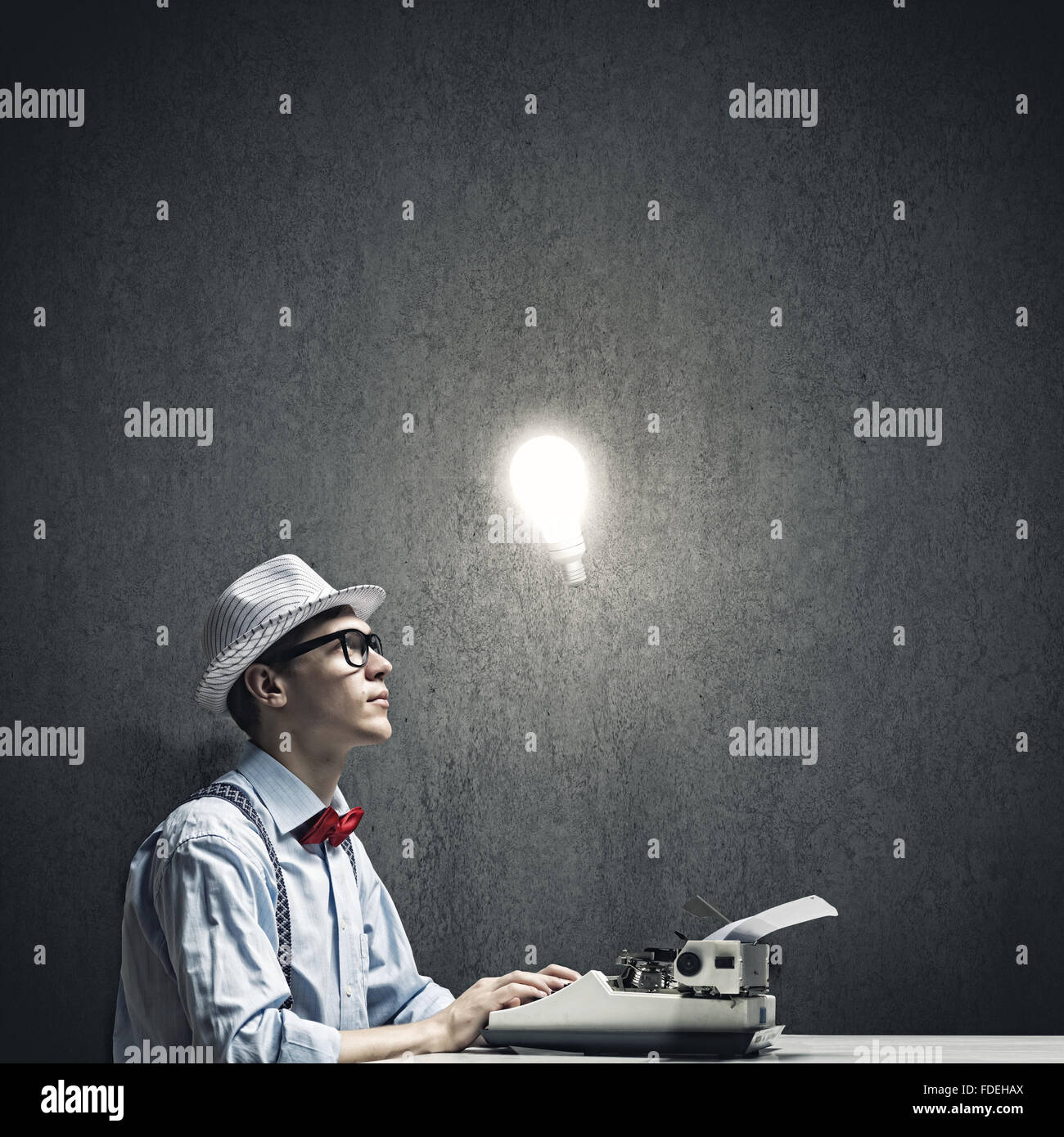 Young funny man in glasses writing on typewriter Stock Photo - Alamy