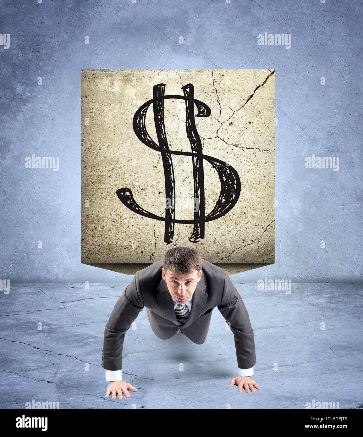 Businessman doing push-ups with stone on back Stock Photo - Alamy