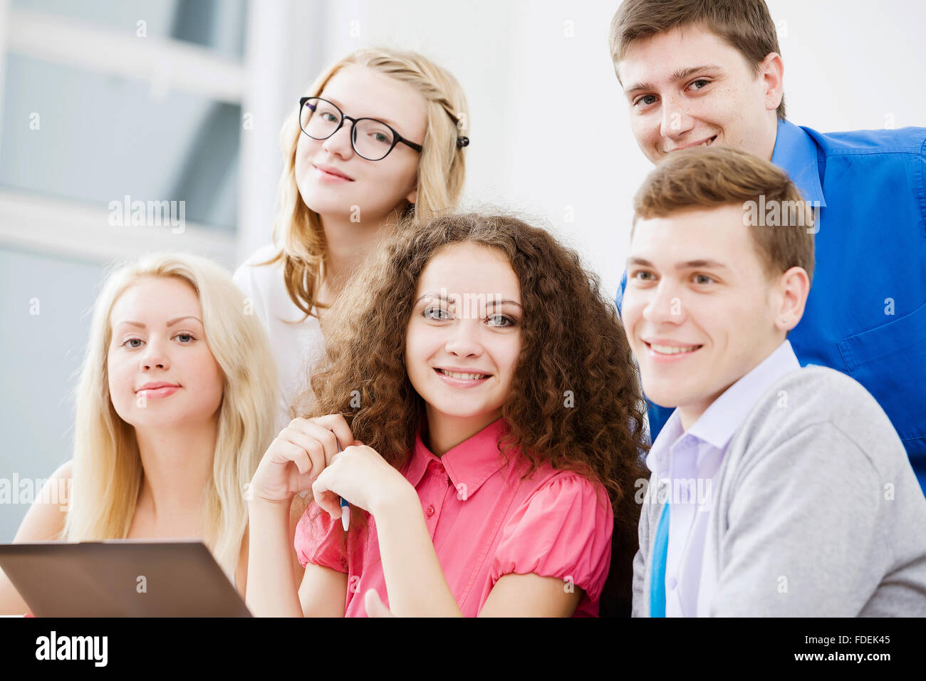Young people sitting in classroom at lecture Stock Photo - Alamy