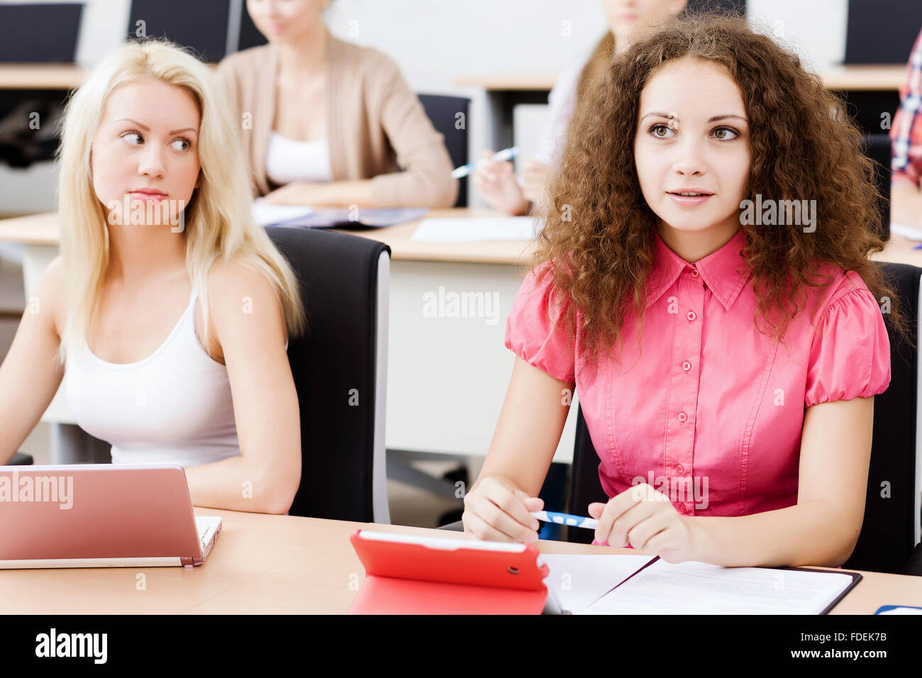 Young people sitting in classroom at lecture Stock Photo - Alamy