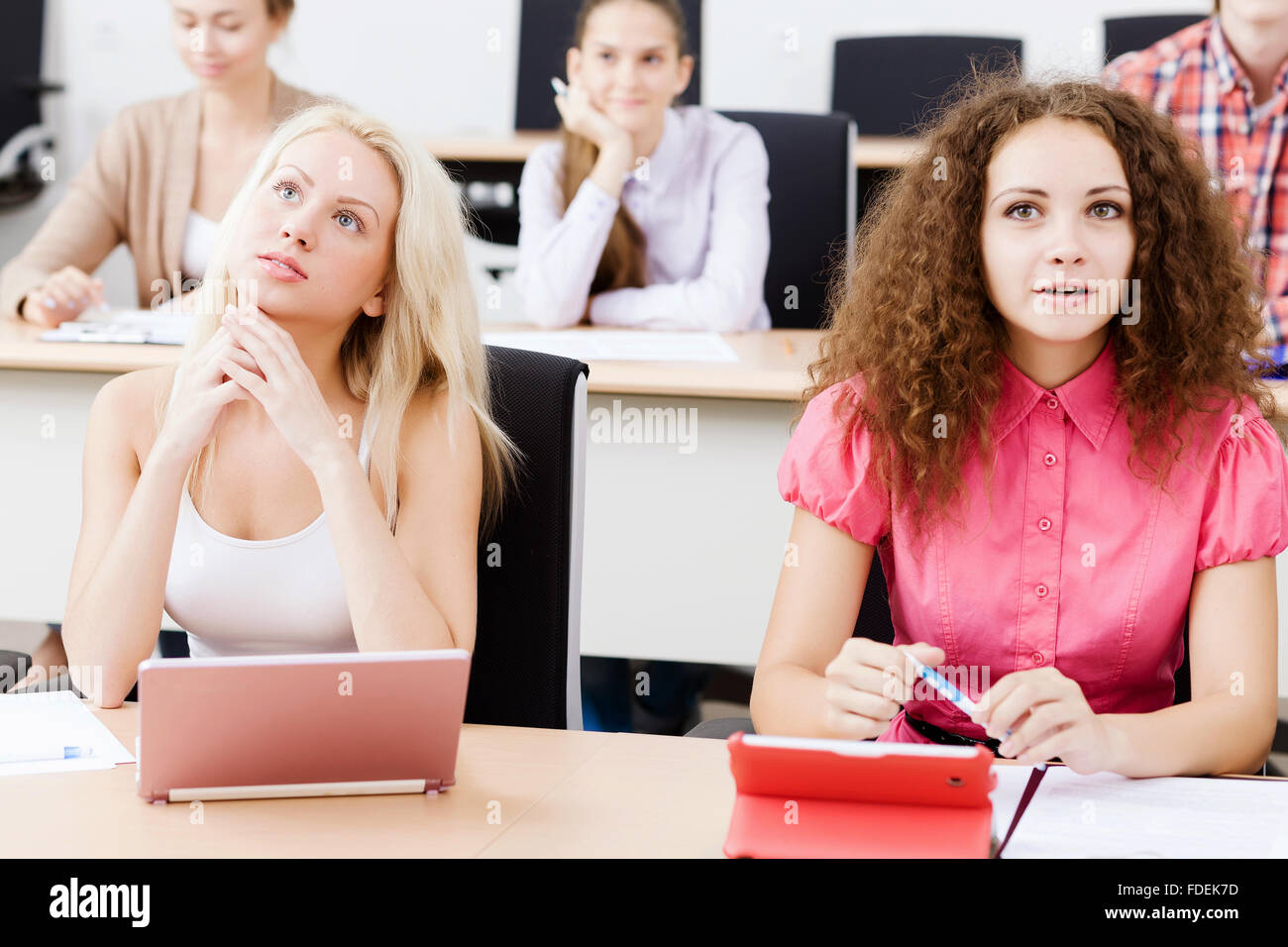 Young people sitting in classroom at lecture Stock Photo - Alamy