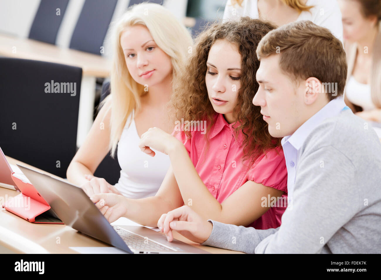 Young people sitting in classroom at lecture Stock Photo - Alamy