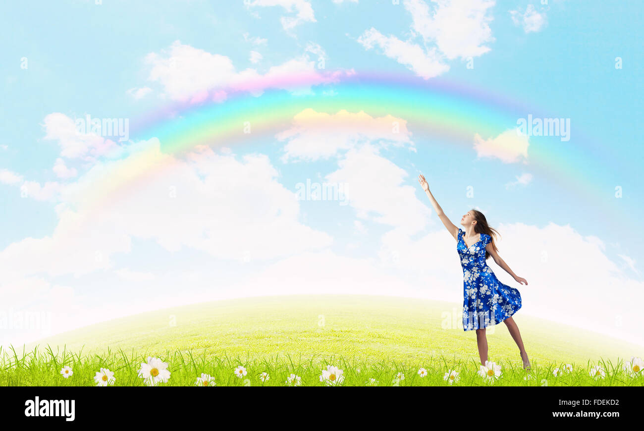 Happy young woman dreaming to fly in sky Stock Photo - Alamy