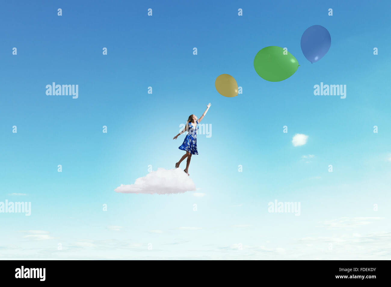 Happy young woman dreaming to fly in sky Stock Photo - Alamy