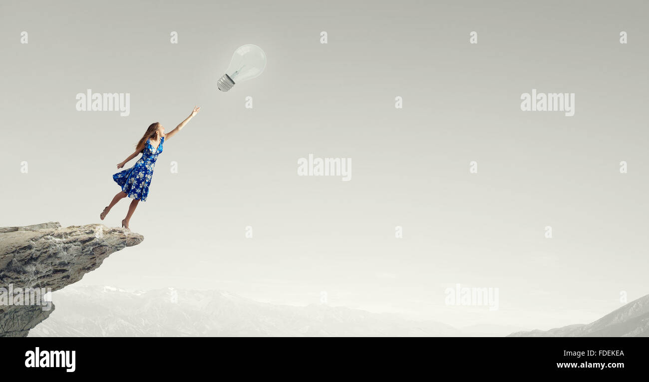 Happy young woman dreaming to fly in sky Stock Photo - Alamy