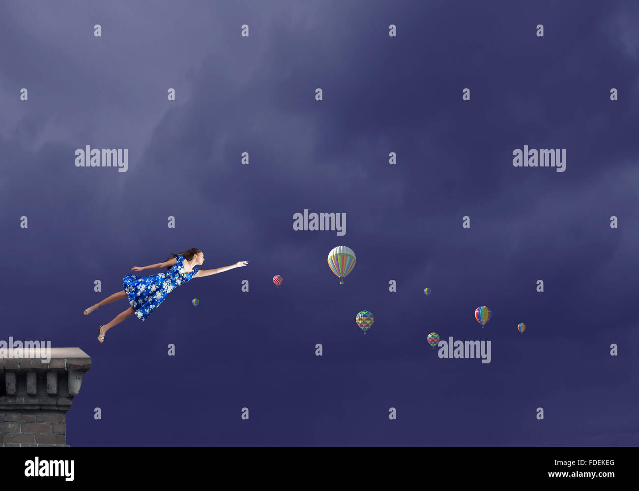 Happy young woman dreaming to fly in sky Stock Photo - Alamy