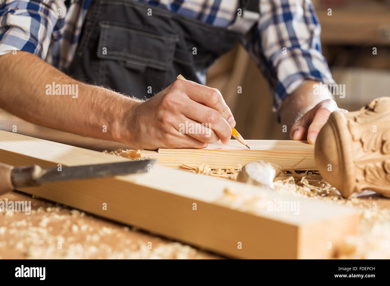 Young carpenter working with cutter in his studio Stock Photo - Alamy