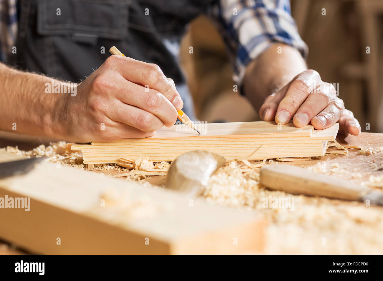 Young carpenter working with cutter in his studio Stock Photo - Alamy