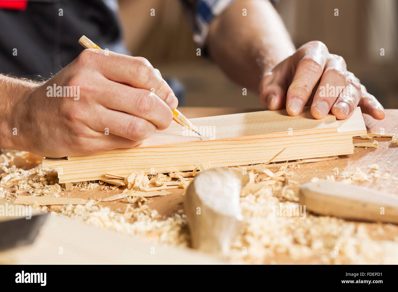 Young carpenter working with cutter in his studio Stock Photo - Alamy