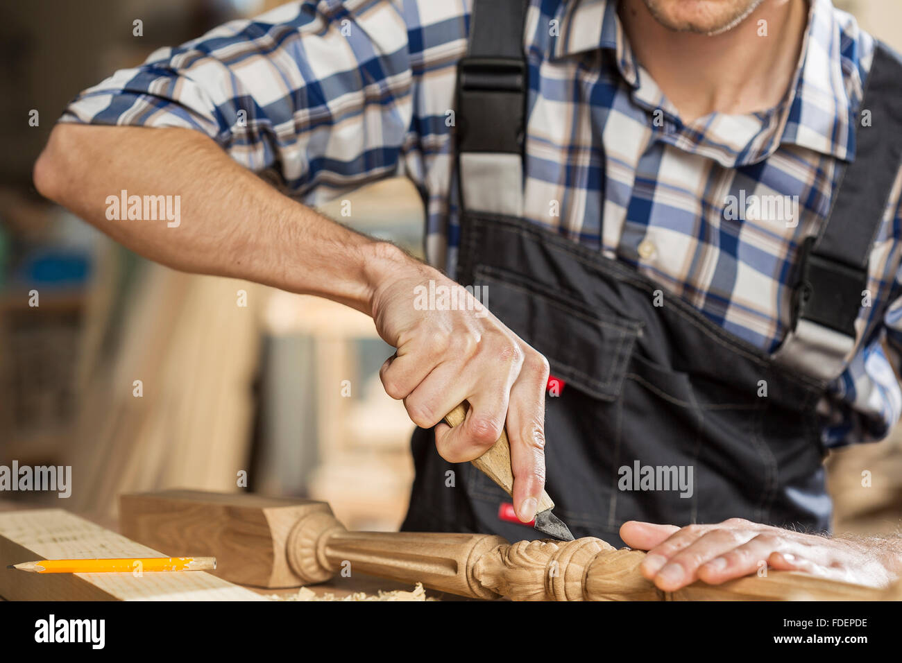 Young carpenter working with cutter in his studio Stock Photo - Alamy