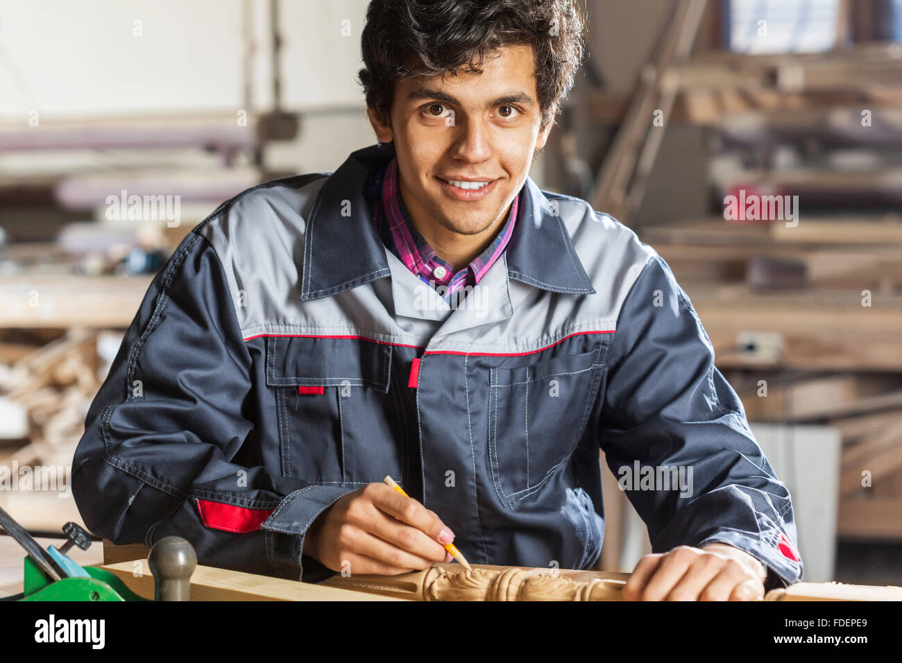 Young carpenter working with cutter in his studio Stock Photo - Alamy