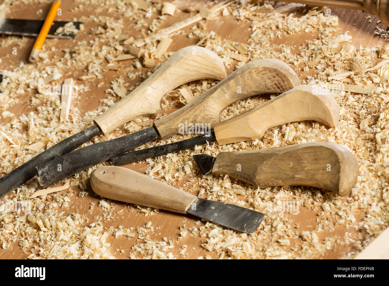 Cutters for wood and wood shavings on table Stock Photo - Alamy