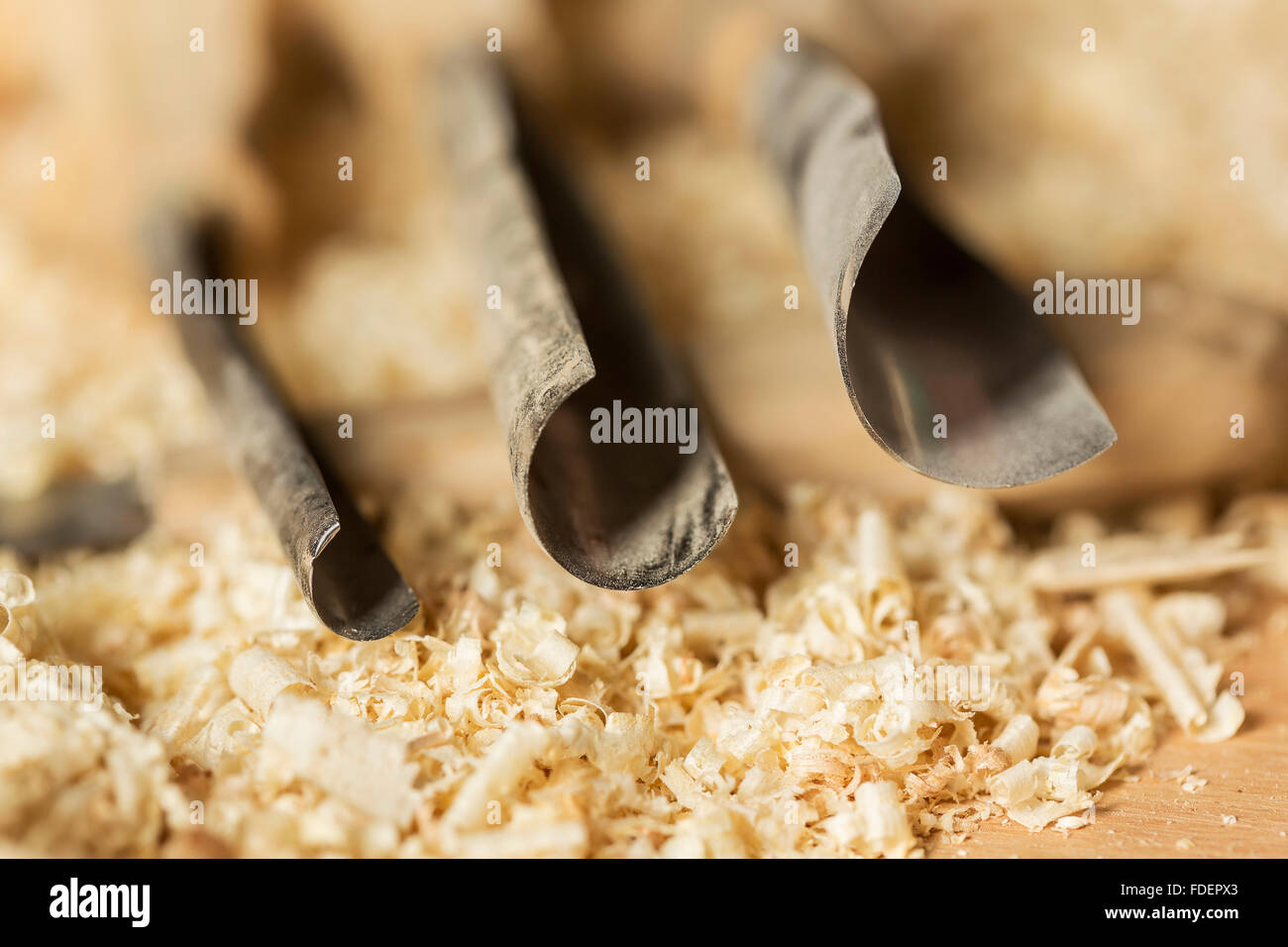 Cutters for wood and wood shavings on table Stock Photo - Alamy