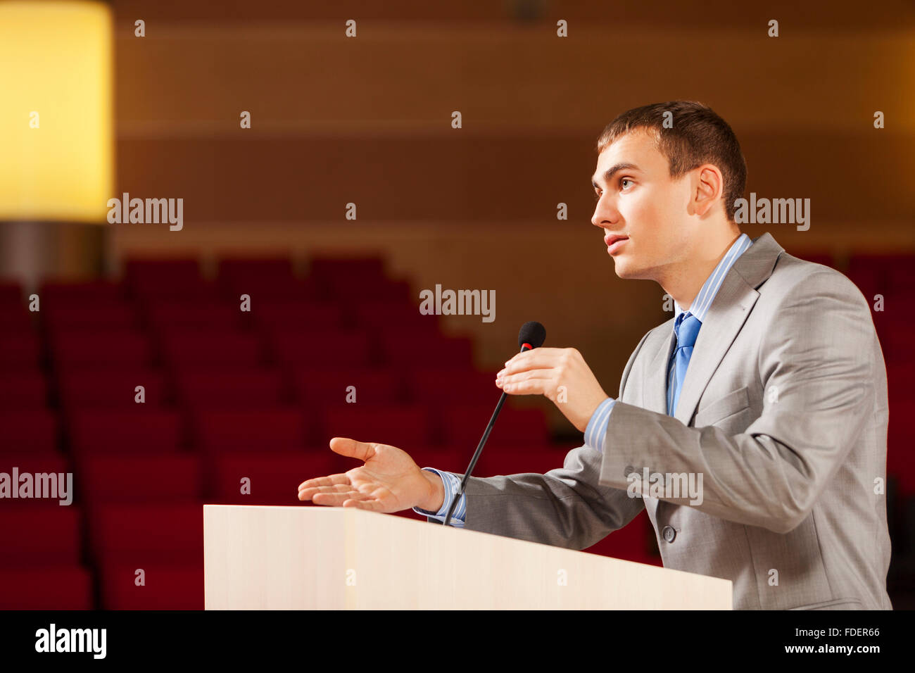 Man gesture podium lecture stage hi-res stock photography and images ...