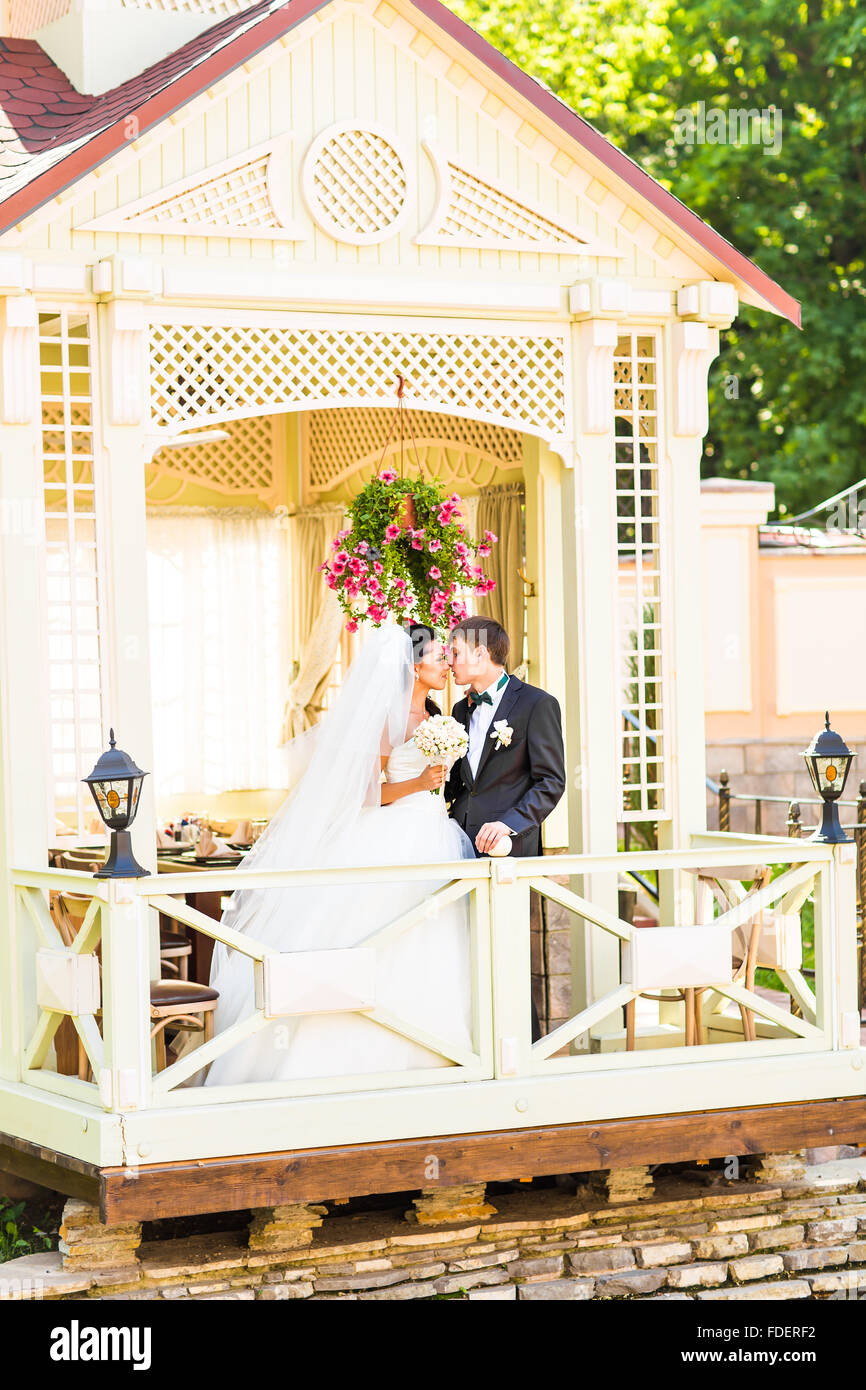 Wedding, Beautiful Romantic Bride with the Groom Kissing and Embracing ...