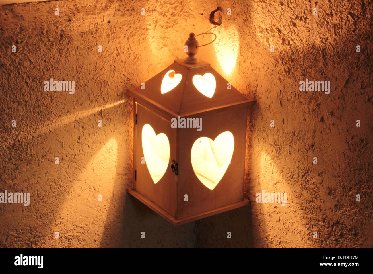 romantic indoor lanterns with hearts Stock Photo - Alamy