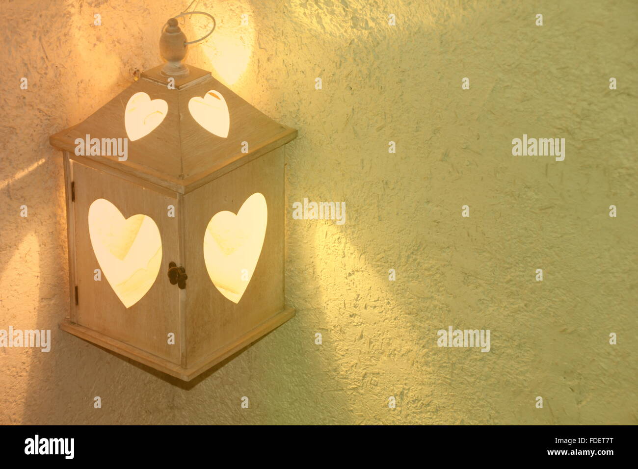 romantic indoor lanterns with hearts Stock Photo - Alamy