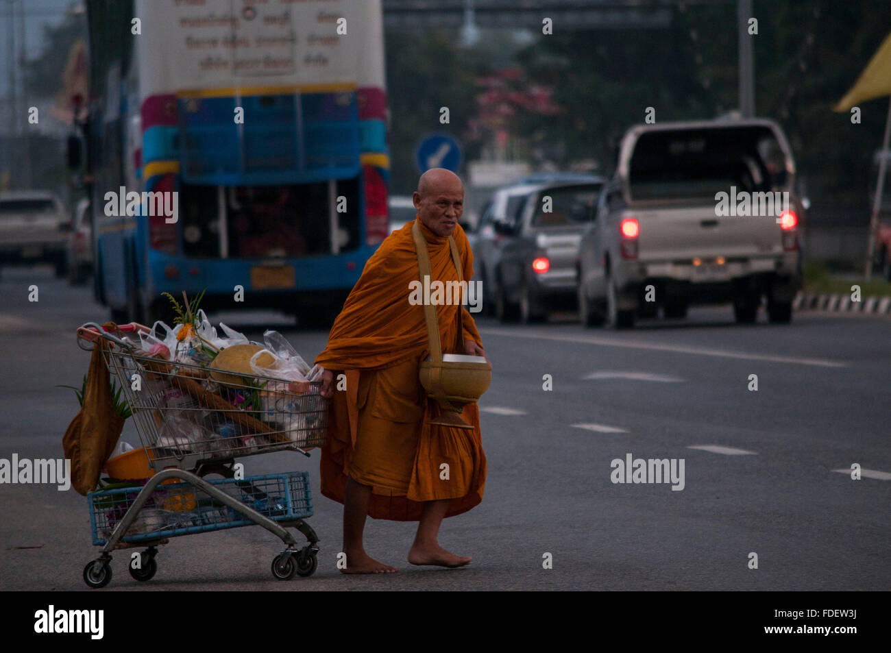 Monk Crossing The Road Stock Photo - Alamy