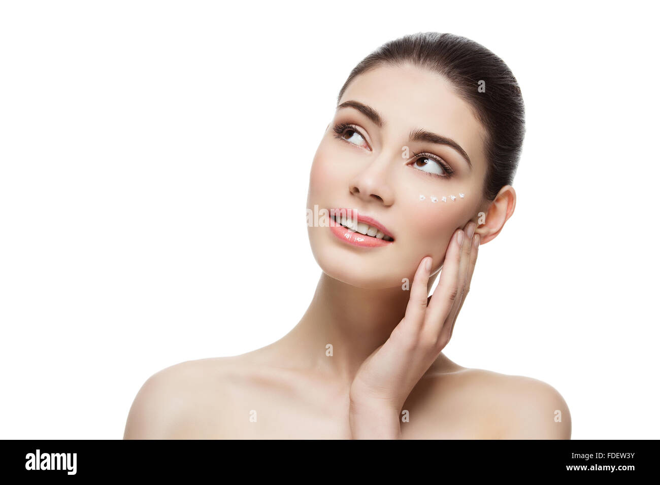 Girl with cream dots on face Stock Photo - Alamy