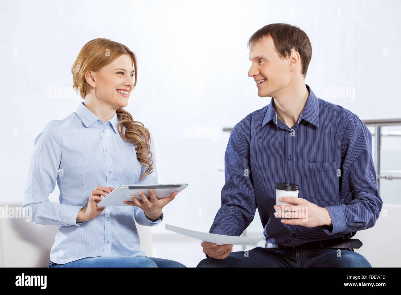 Two young business partners discussing plans or ideas at meeting Stock ...