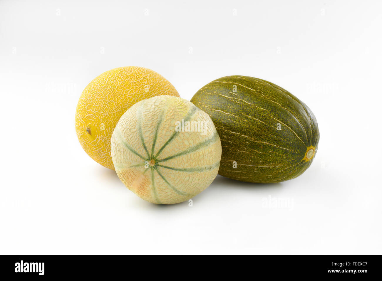 three fresh melons on white background Stock Photo - Alamy