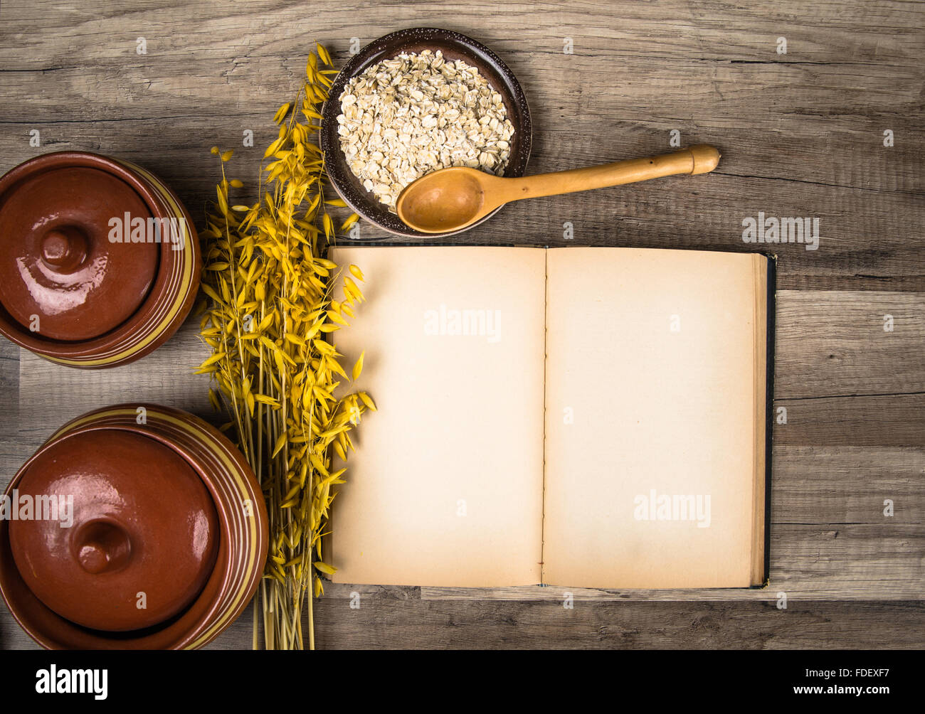 The top view on the opened cookbook and kitchen utensils Stock Photo ...