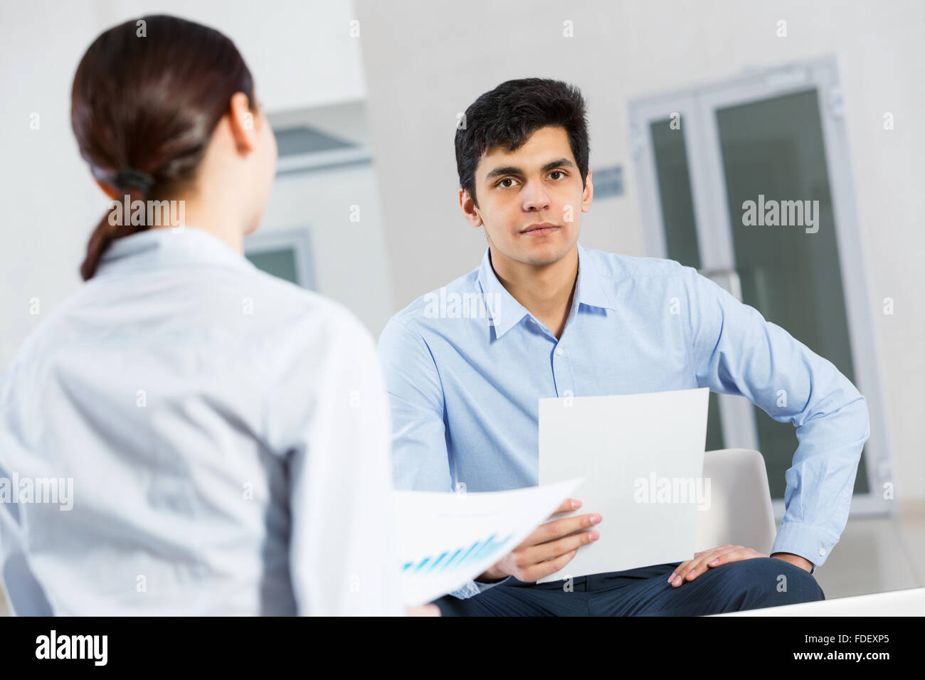 Two students discussion with paper hi-res stock photography and images ...