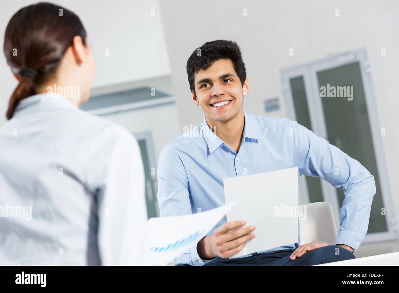 Two students discussion with paper hi-res stock photography and images ...