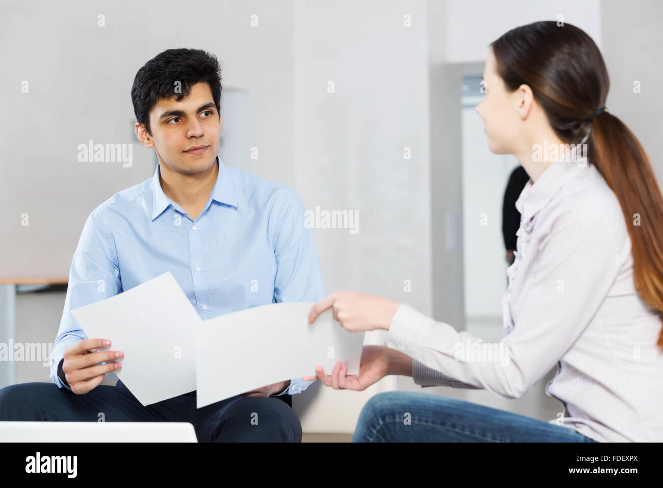Two students discussion with paper hi-res stock photography and images ...