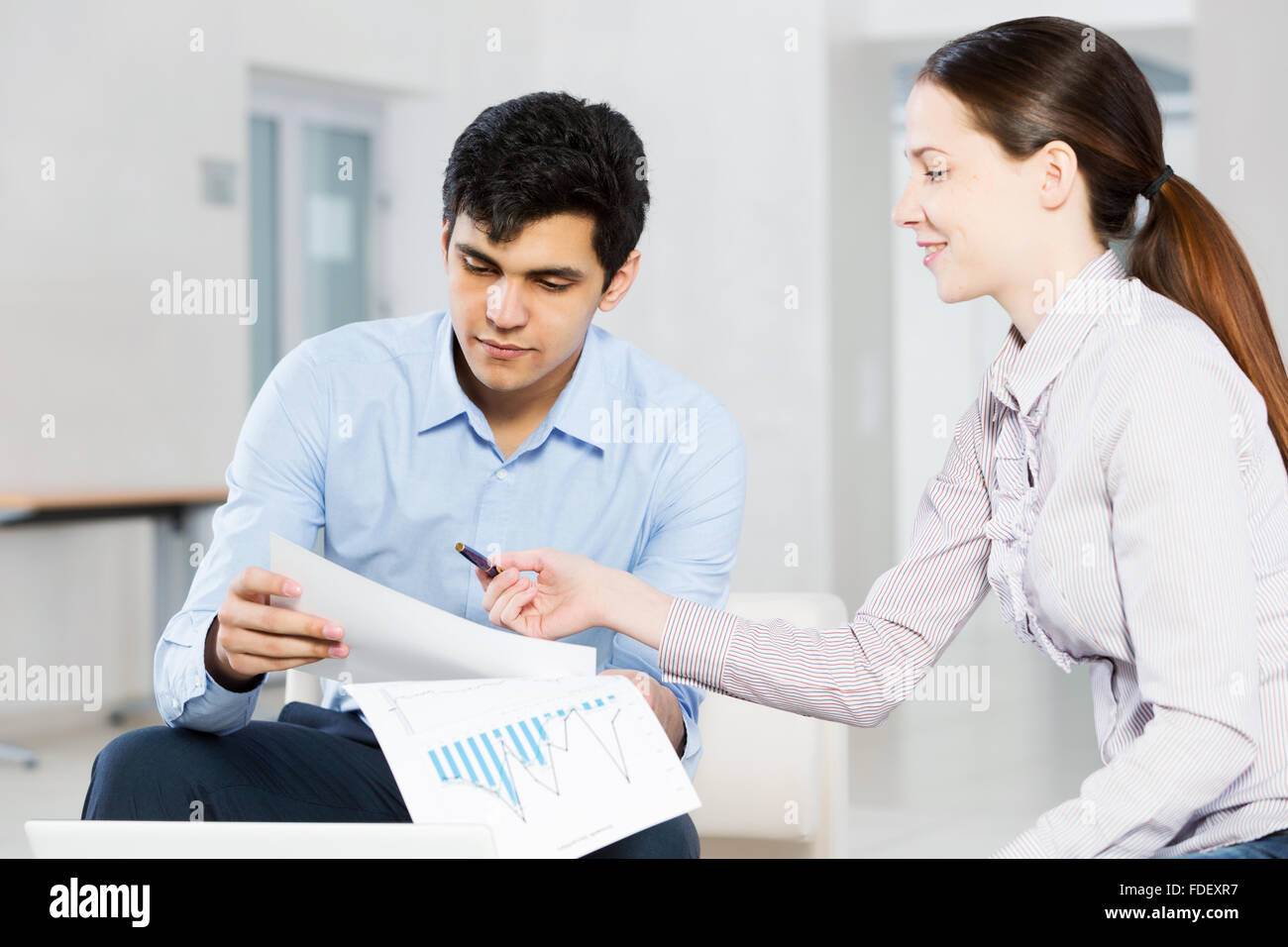 Two students discussion with paper hi-res stock photography and images ...