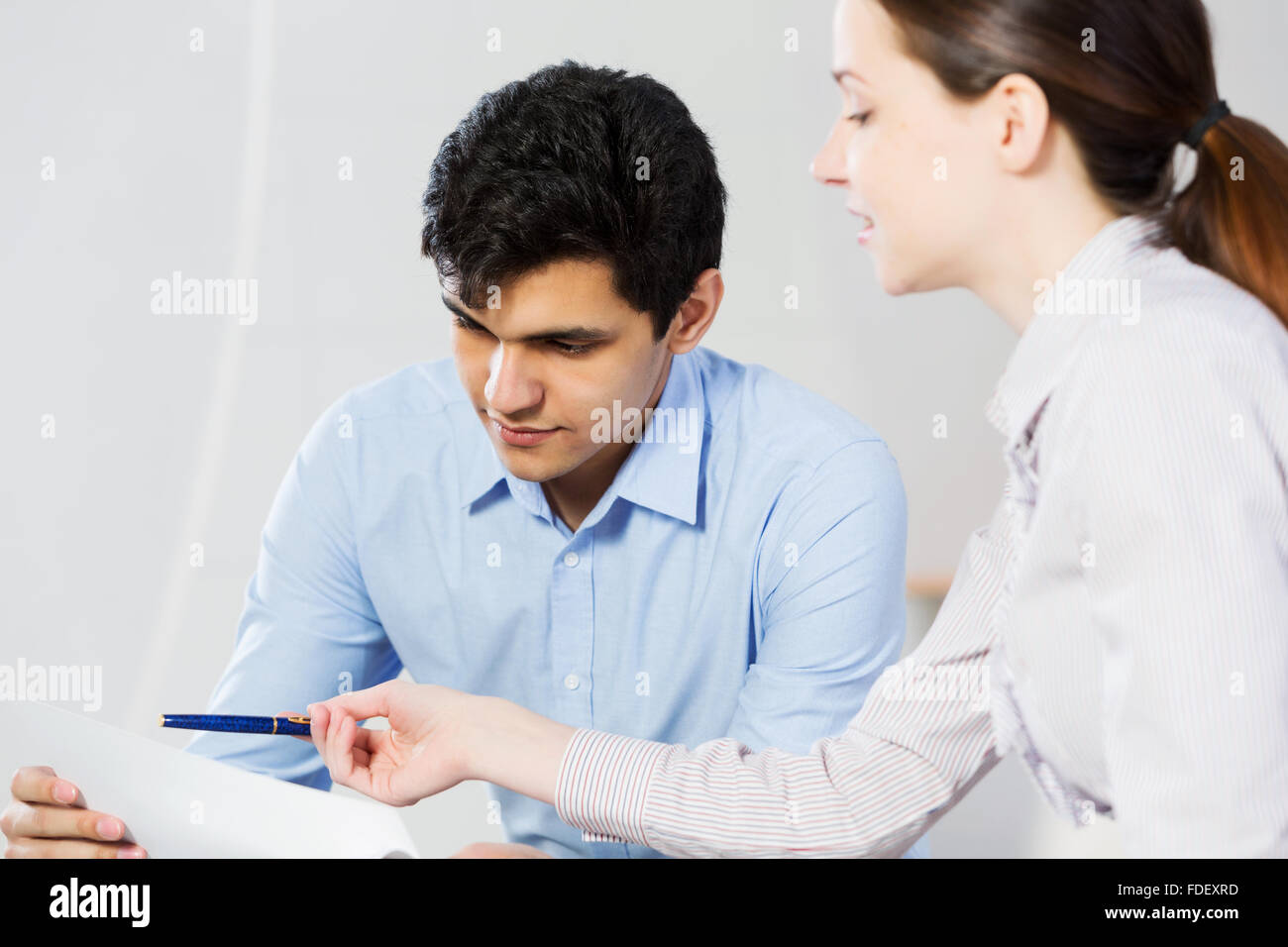 Two students discussion with paper hi-res stock photography and images ...