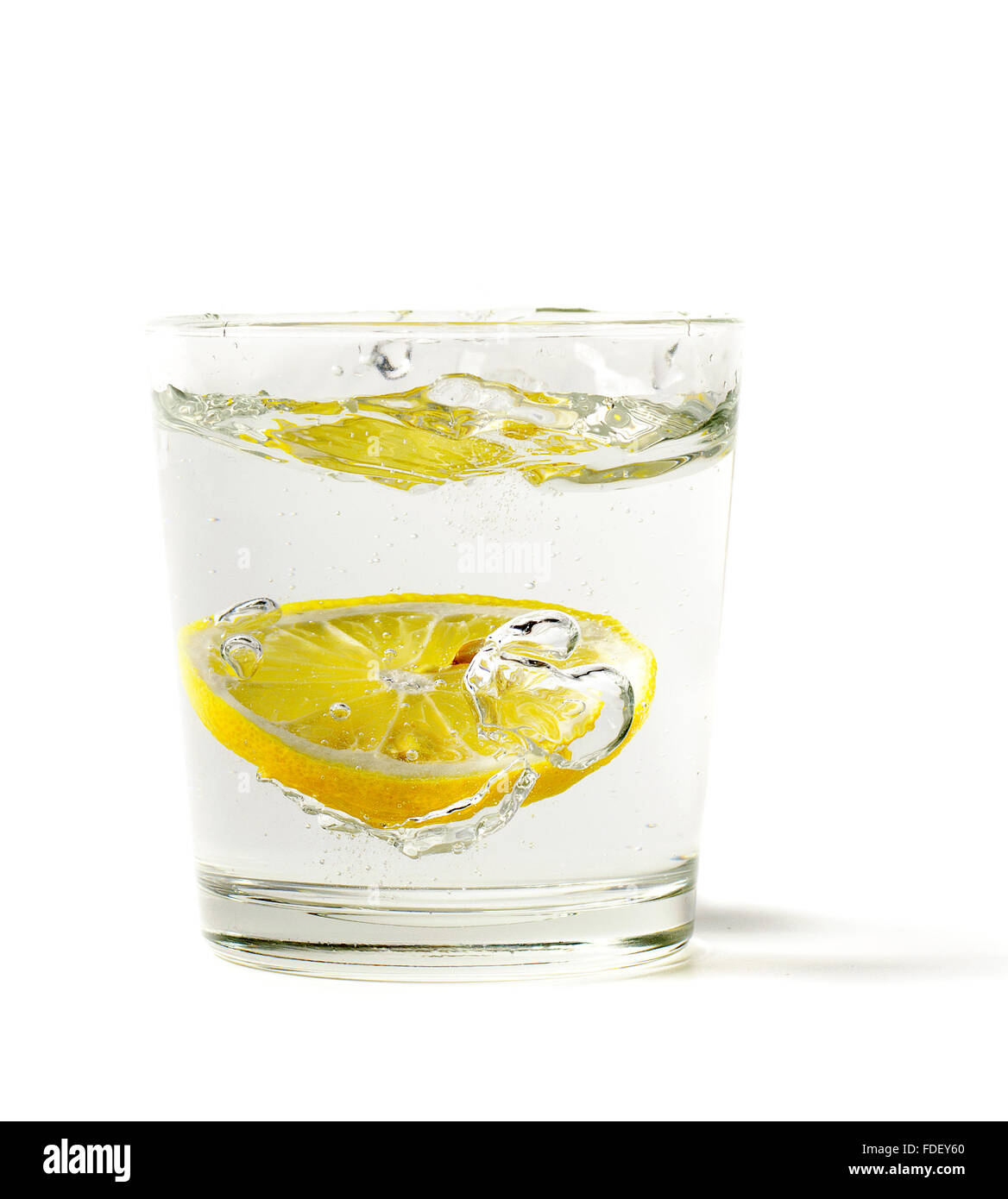 lemon splashing in glass Stock Photo - Alamy