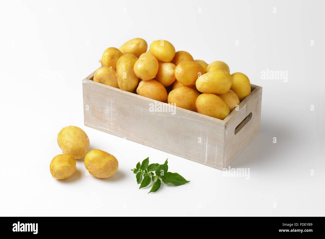 box of fresh potatoes on white background Stock Photo - Alamy